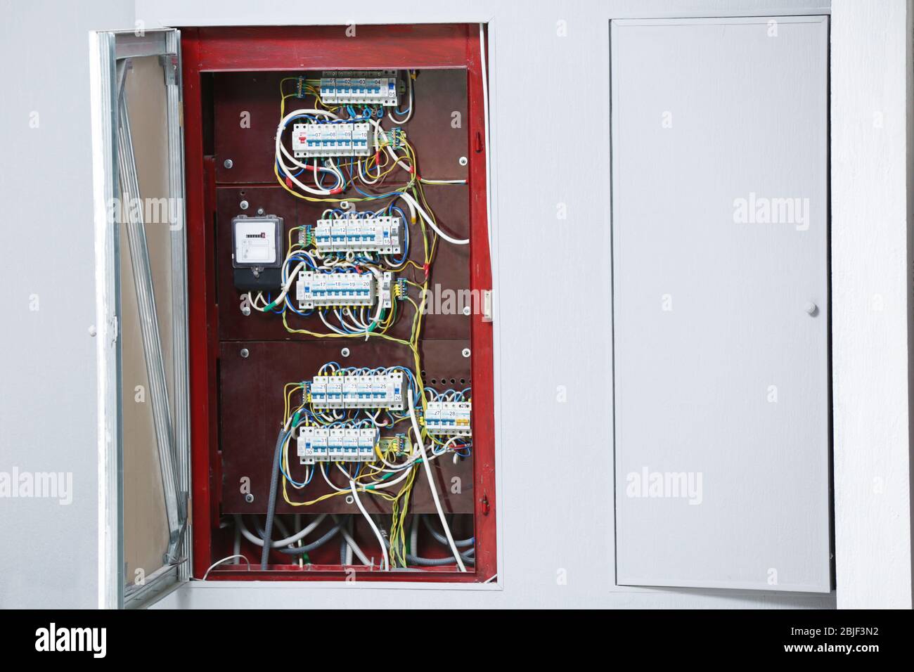 Open distribution board integrated in wall Stock Photo - Alamy