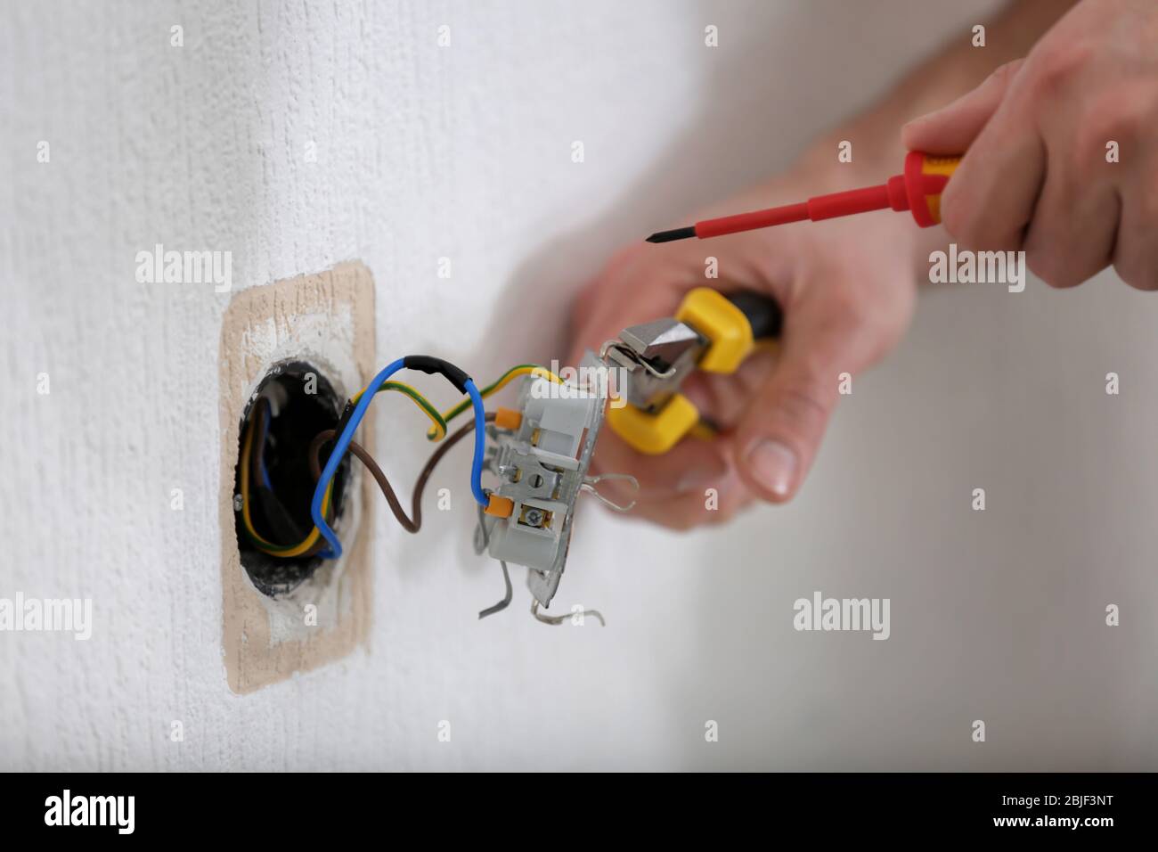 Installing socket hi-res stock photography and images - Alamy