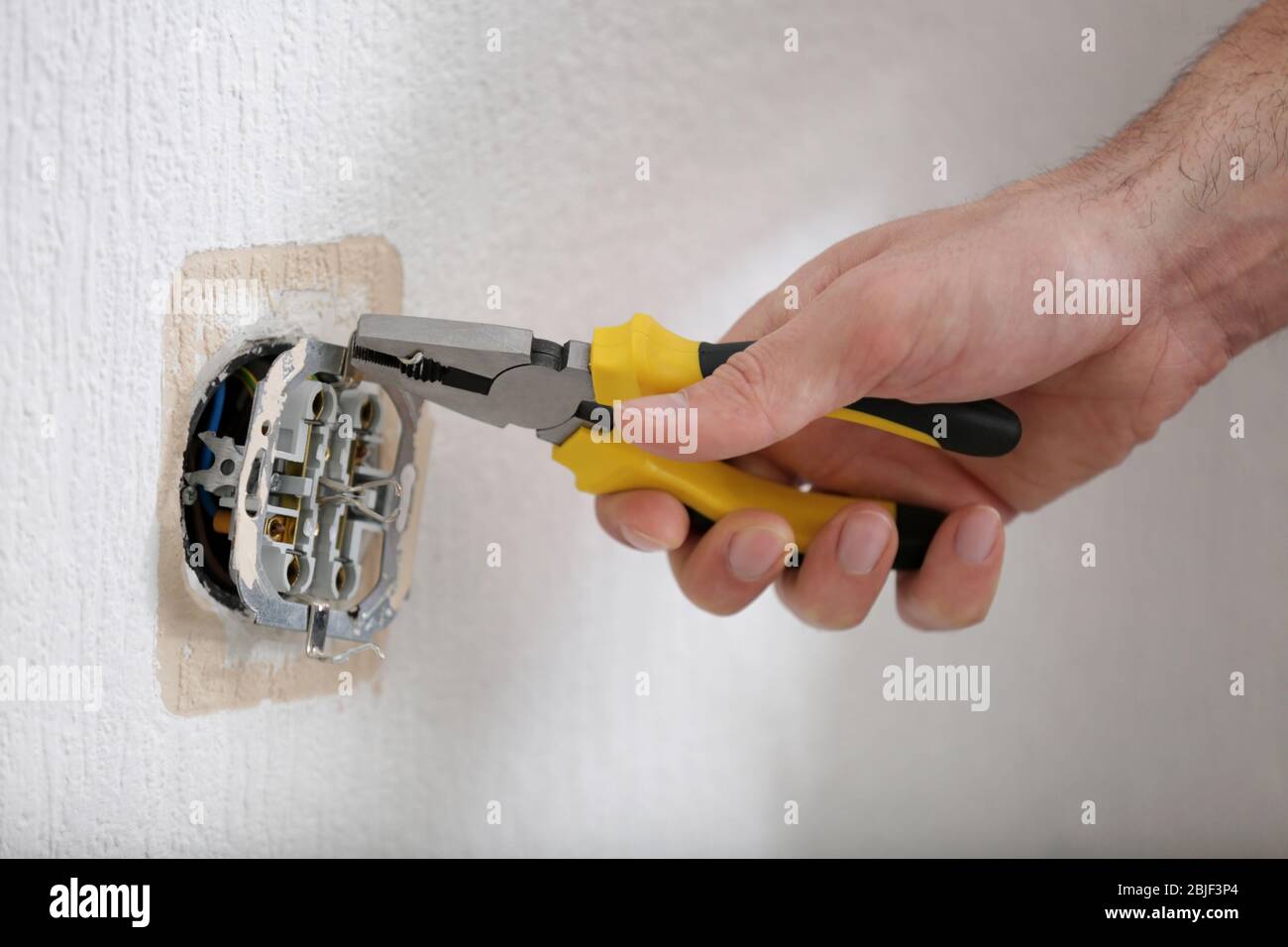 Installing socket hi-res stock photography and images - Alamy