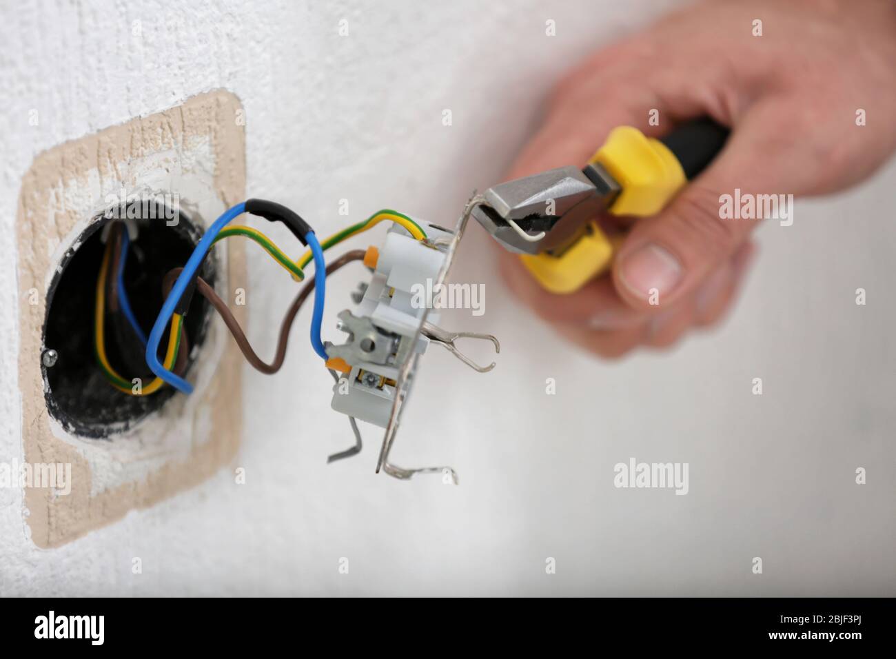 Installing socket hi-res stock photography and images - Alamy