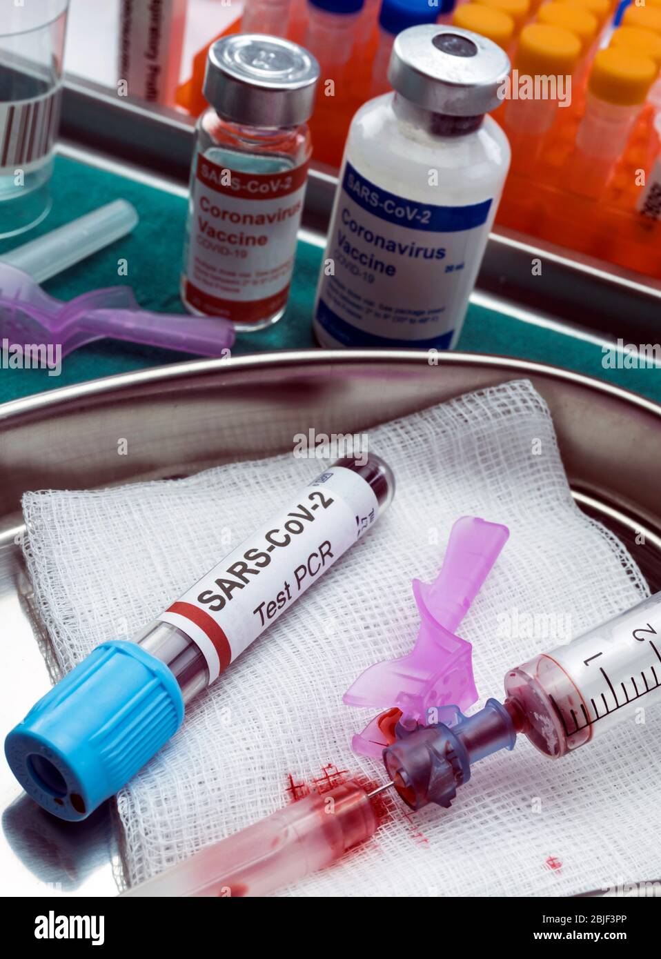 syringe with blood sample from infected person covid-19 together with ...