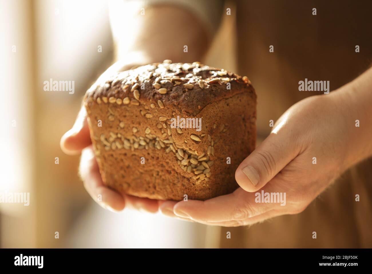 Male chef with loaf of bread, closeup Stock Photo - Alamy