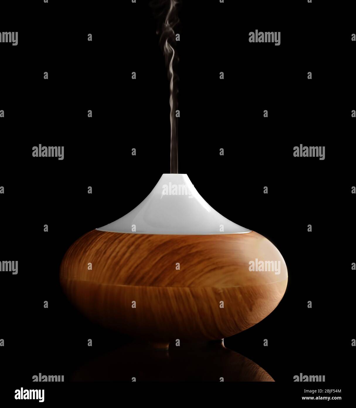 Aroma oil diffuser on black background Stock Photo - Alamy