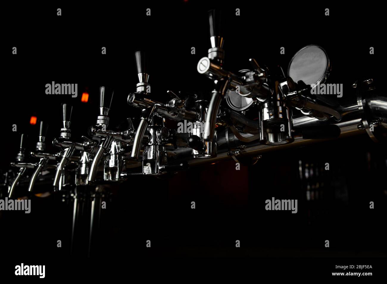 Beer taps bar brewery pints. many beer taps in bar or pub Stock Photo ...