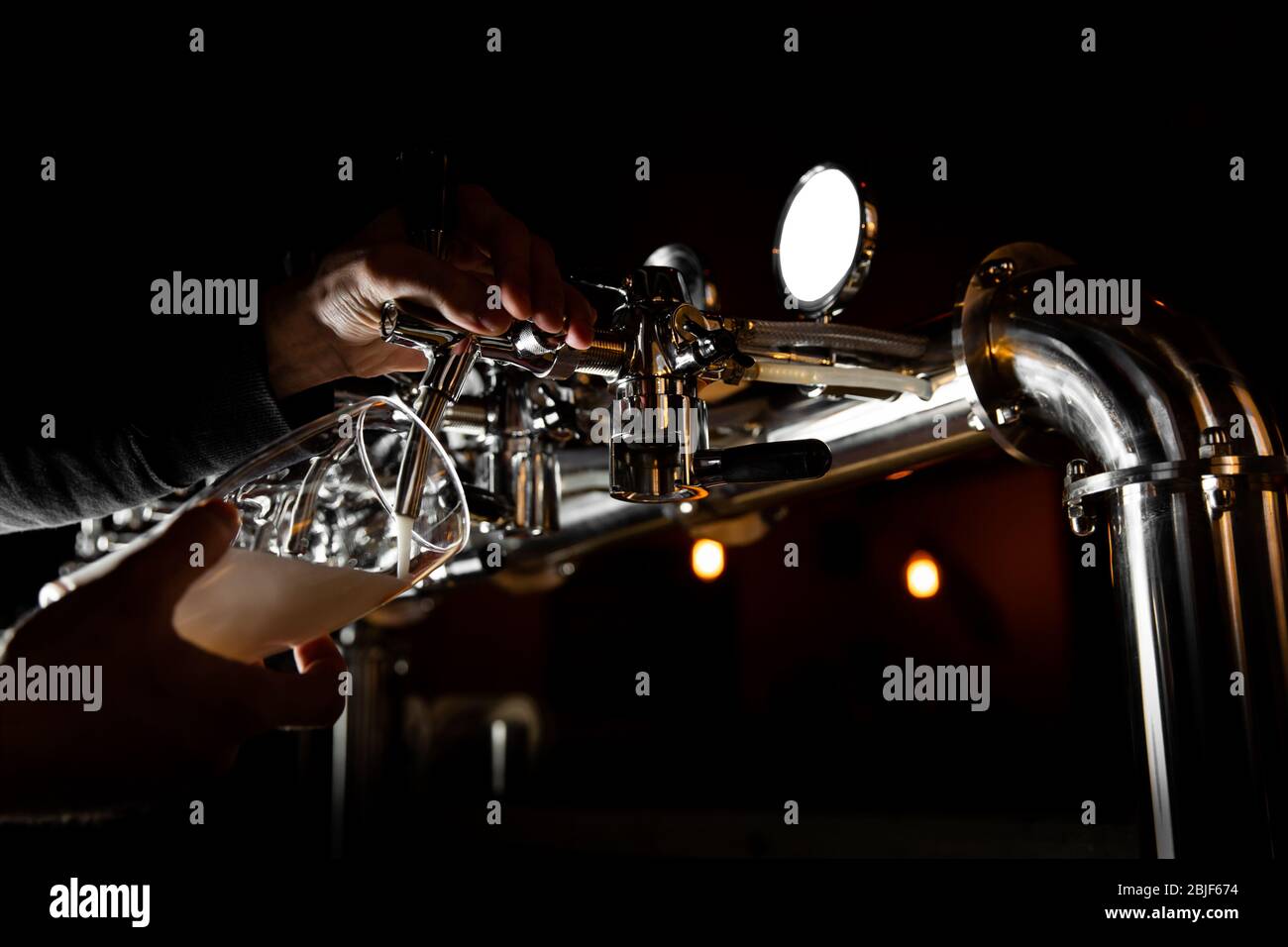Beer tap in bar, mock up with selective focus. Hand of bartender ...