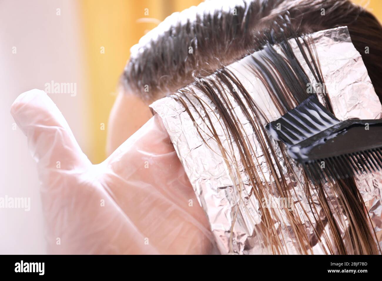 Process of dyeing hair at beauty salon, closeup Stock Photo - Alamy