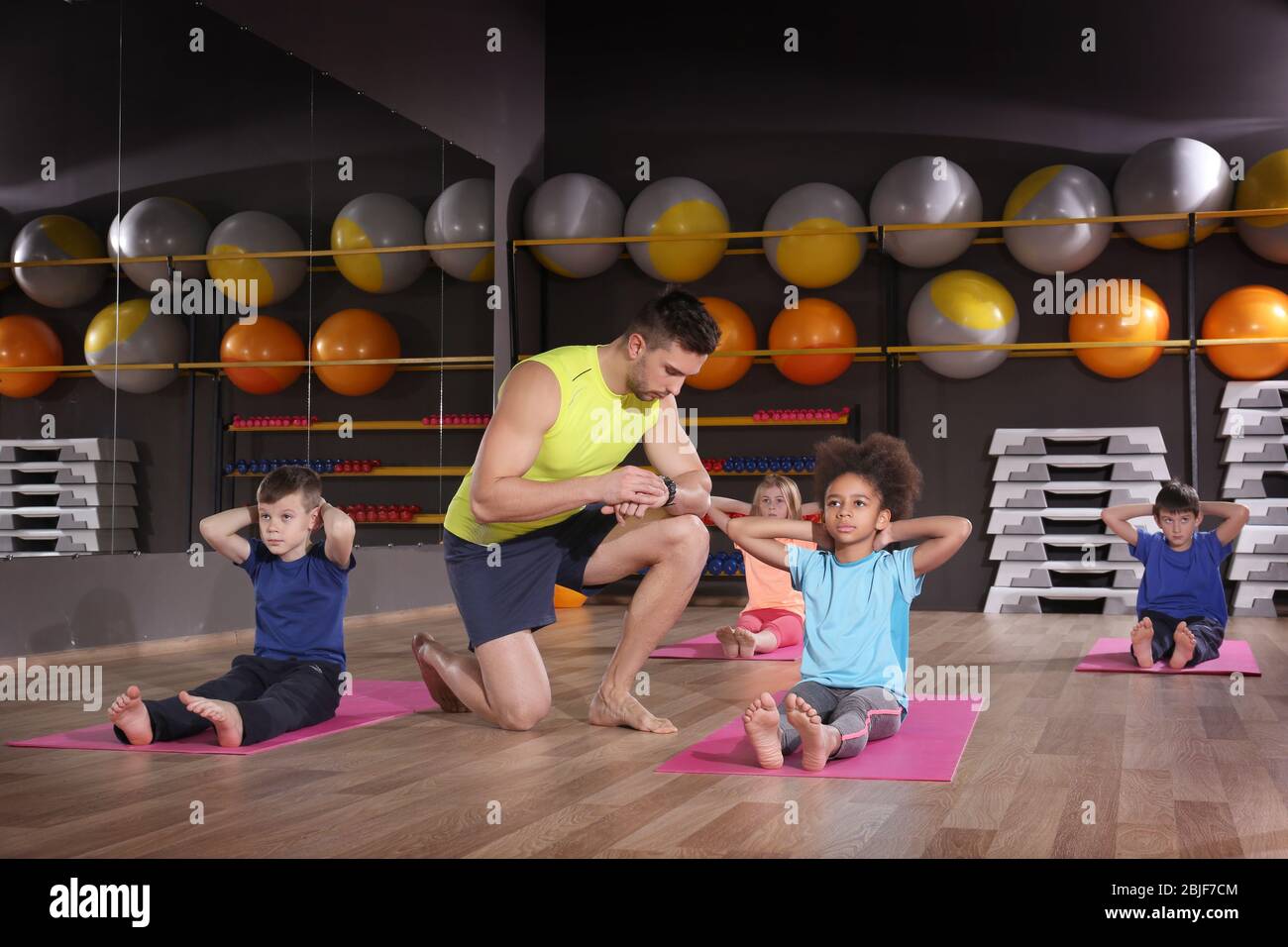 Children at physical education lesson in school gym Stock Photo - Alamy