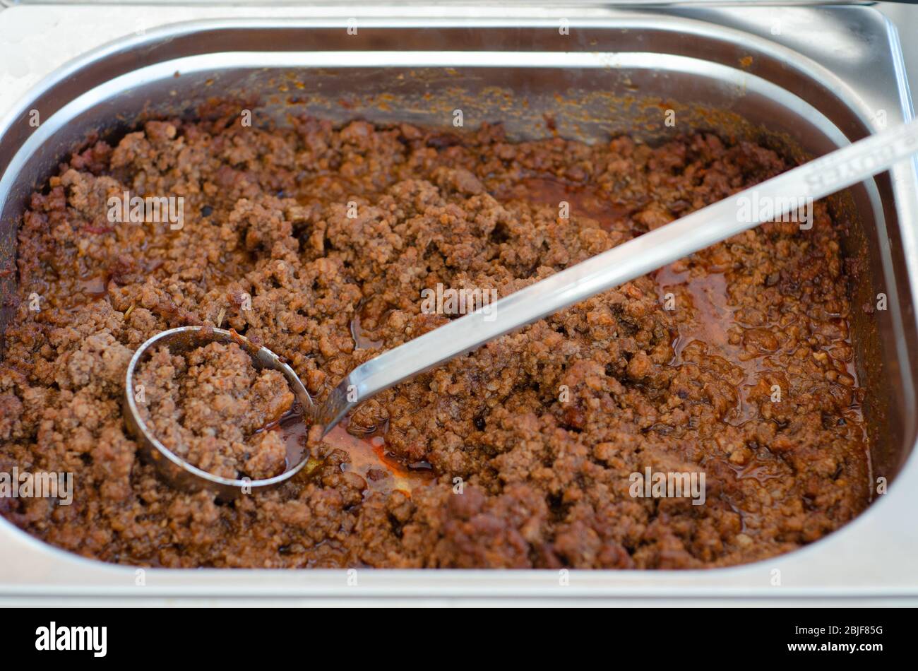 ready minced meat for spaghetti in bain marie pan Stock Photo - Alamy