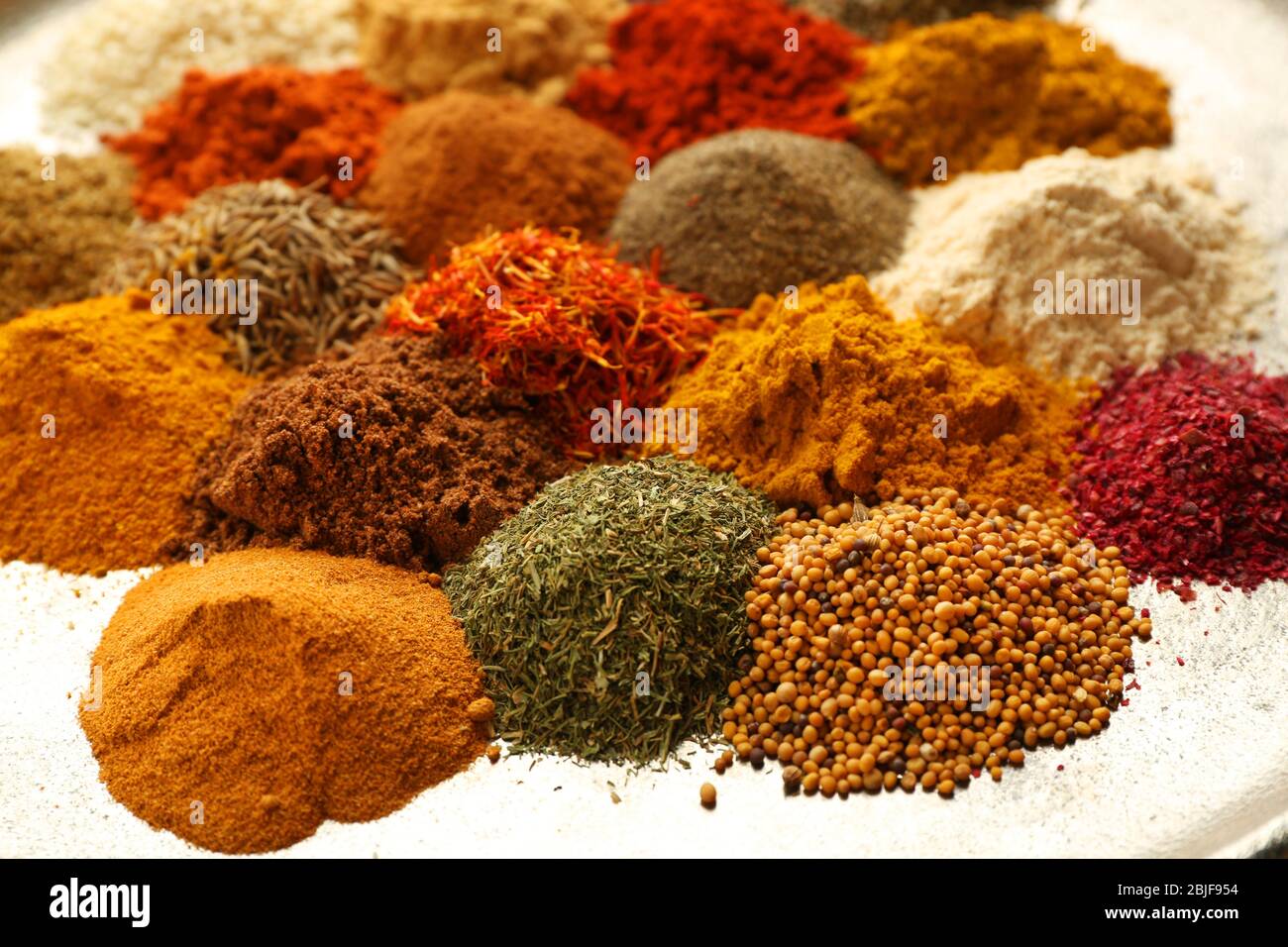 Different spices on tray Stock Photo - Alamy