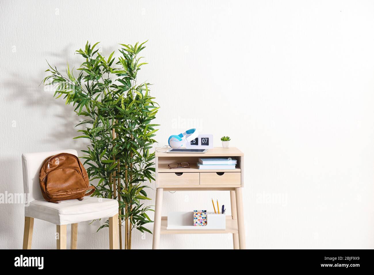 High desk with chair in room Stock Photo - Alamy