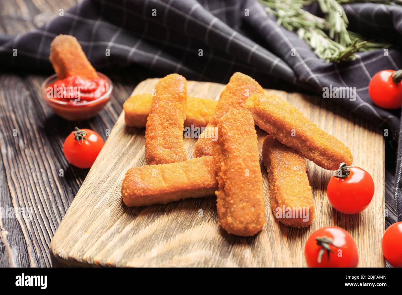 Board with cheese sticks and ketchup sauce on wooden background Stock ...