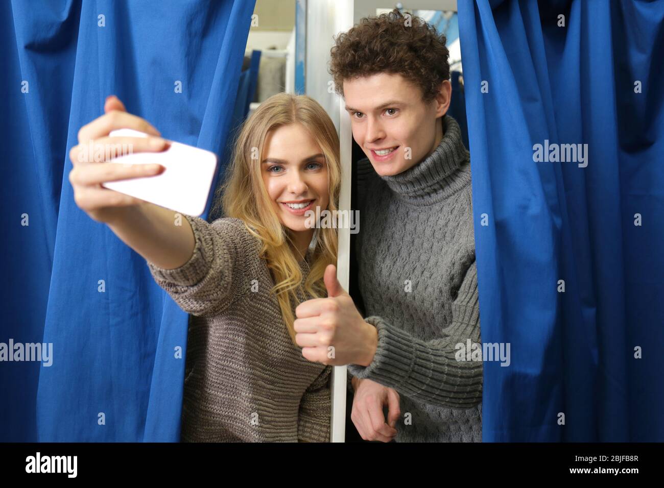 Couple in shop fitting room hi-res stock photography and images - Alamy