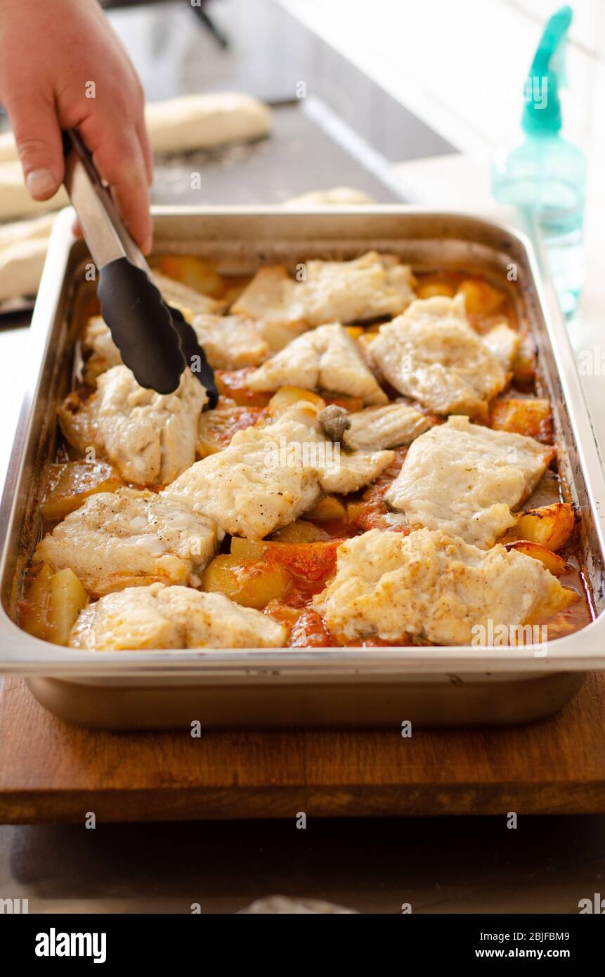 oven pan with fish cooked Stock Photo - Alamy
