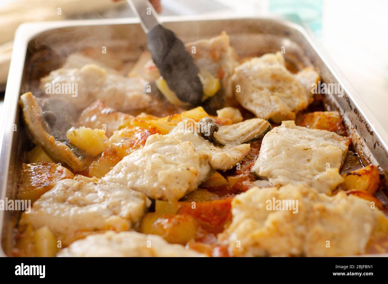 oven pan with fish cooked Stock Photo - Alamy