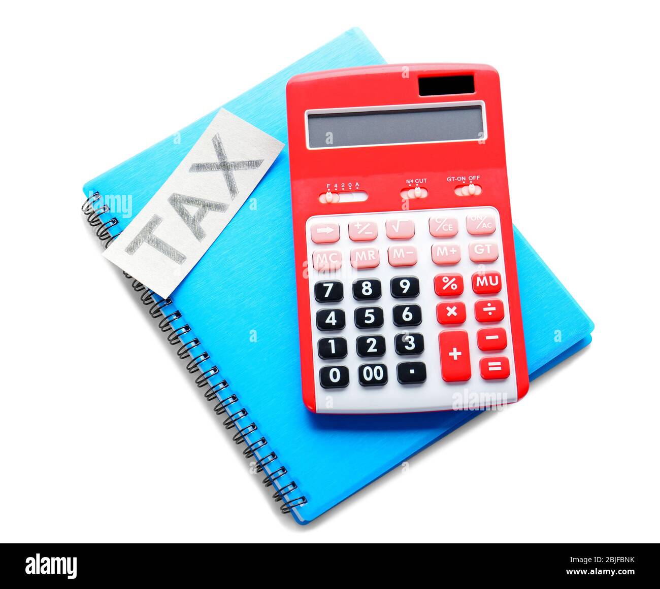 Paper sheet with text TAX, red calculator and blue notepad on white ...