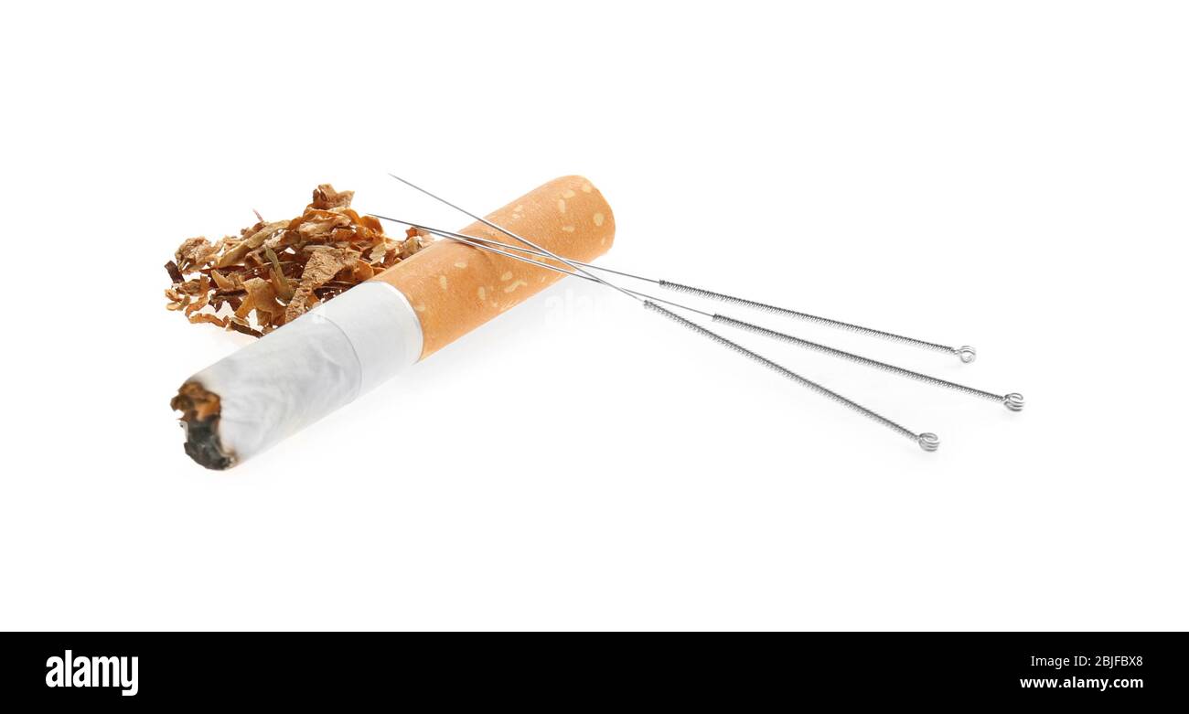 Cigarette with needles and tobacco on white background Stock Photo - Alamy
