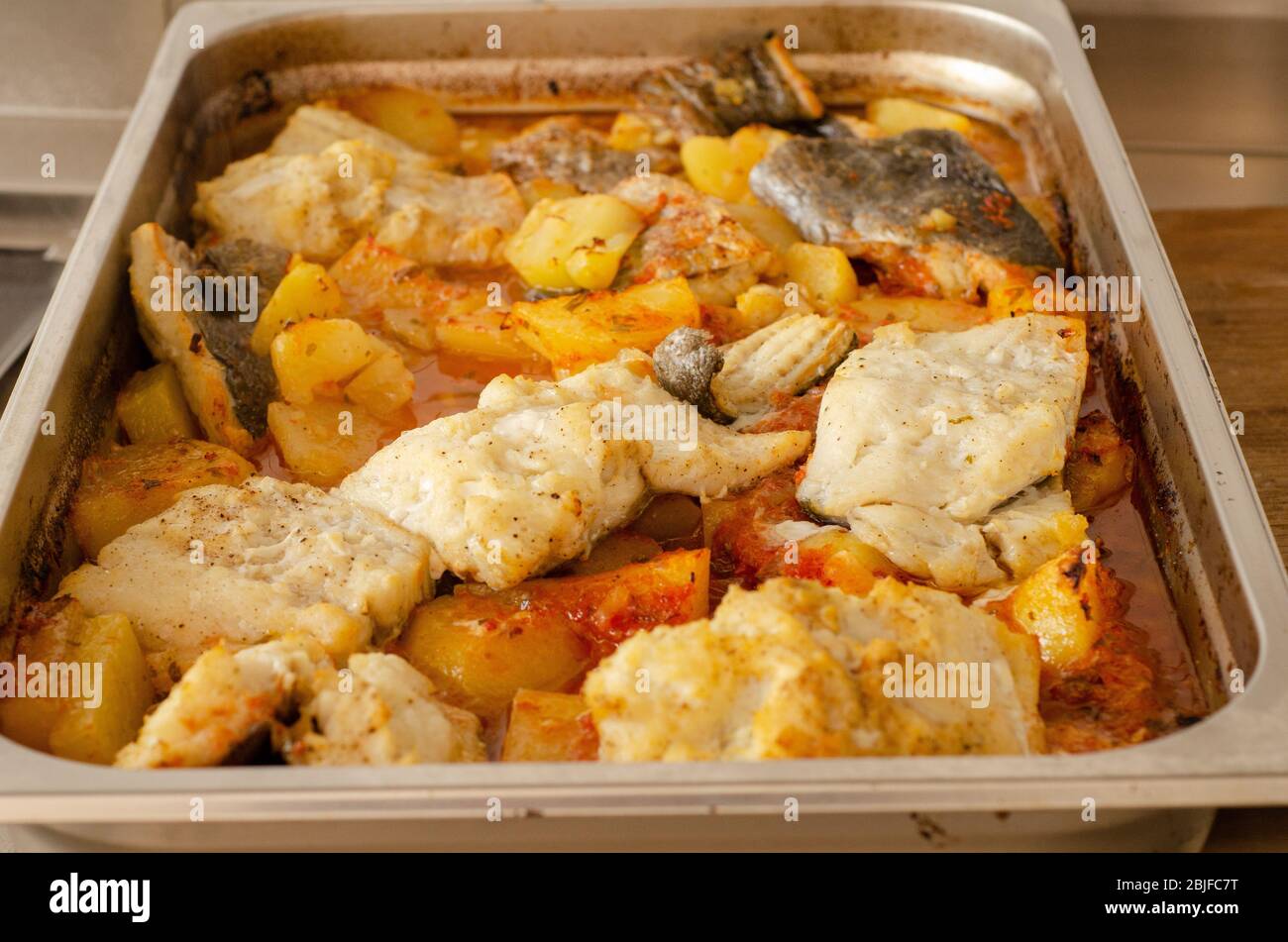 oven pan with fish cooked Stock Photo - Alamy