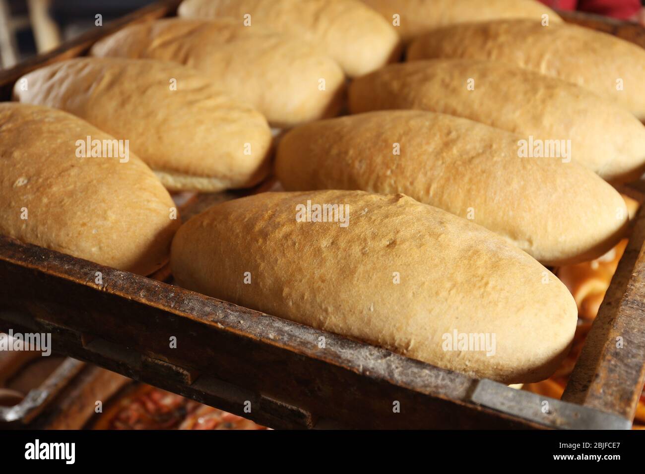 Wooden pallet with bread, closeup Stock Photo - Alamy