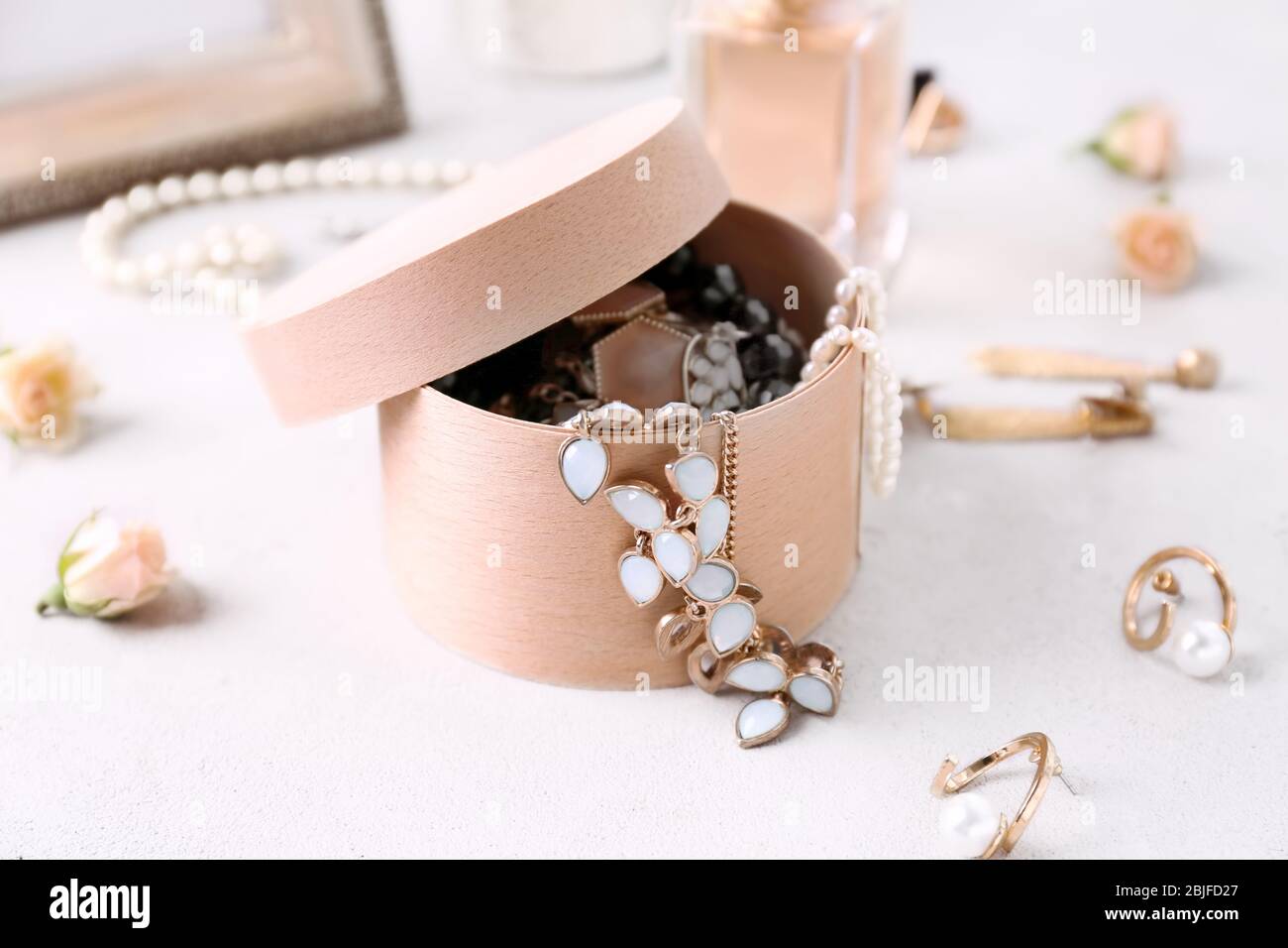 Jewelry and box on light background Stock Photo - Alamy