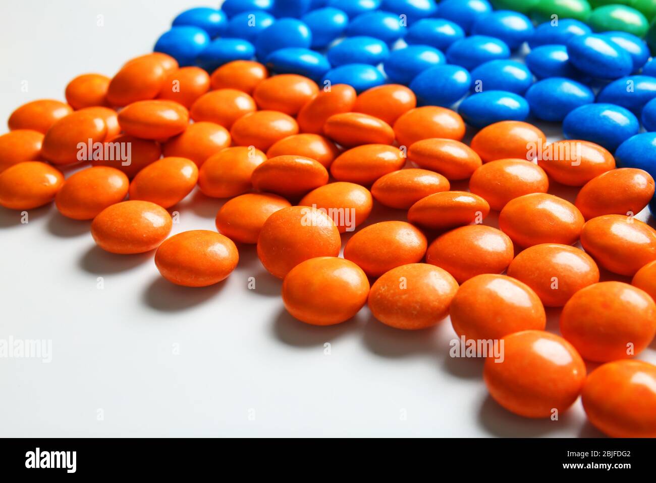 Delicious candies on white background Stock Photo - Alamy