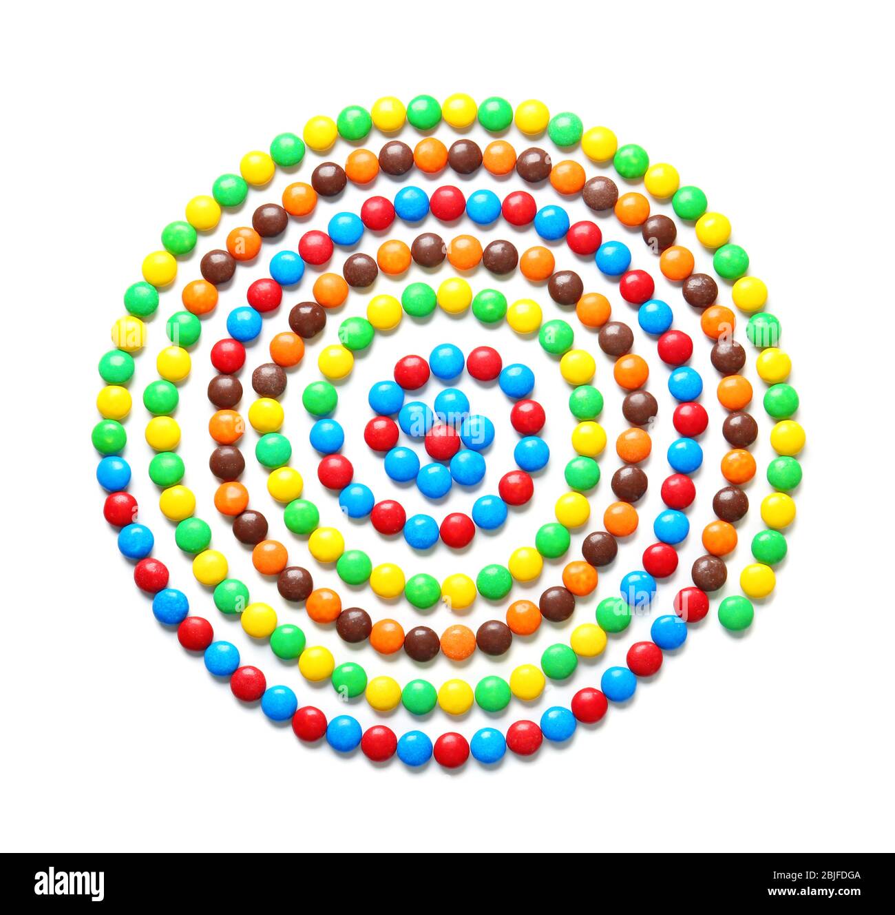 Swirl made of delicious candies on white background Stock Photo - Alamy