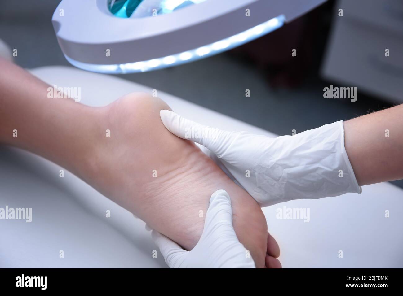 Doctor examining foot woman hi-res stock photography and images - Alamy