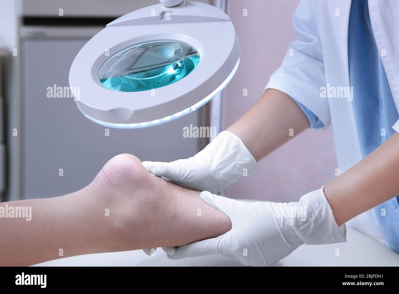 Doctor examining foot woman hi-res stock photography and images - Alamy
