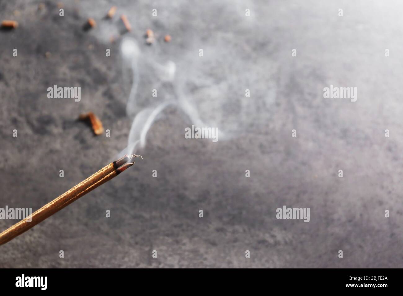 Aroma sticks with smoke Stock Photo - Alamy