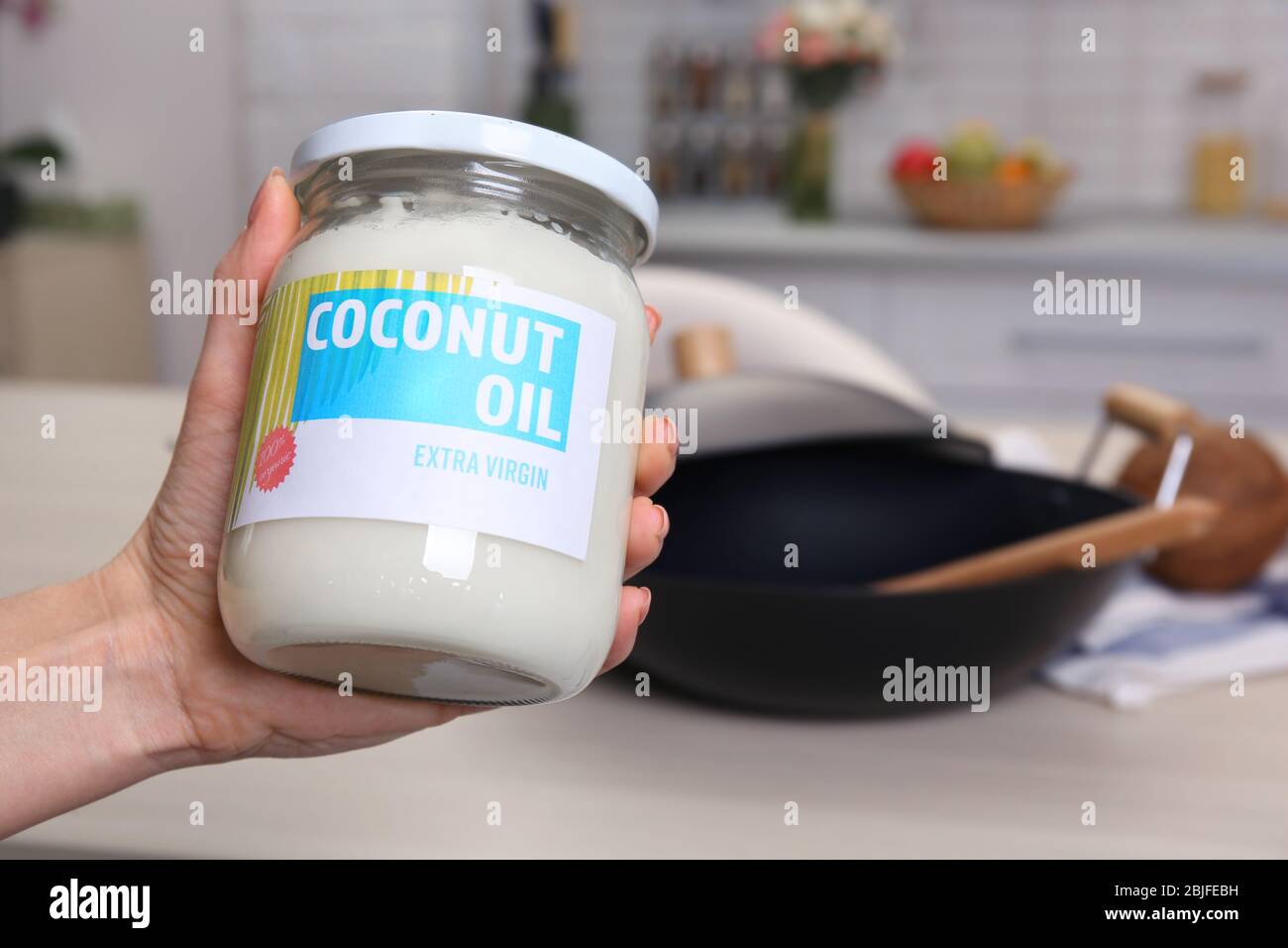 Woman coconut oil cook hi-res stock photography and images - Alamy