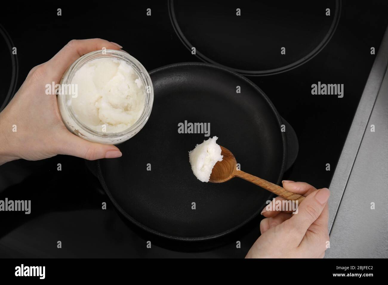 Woman coconut oil cook hi-res stock photography and images - Alamy