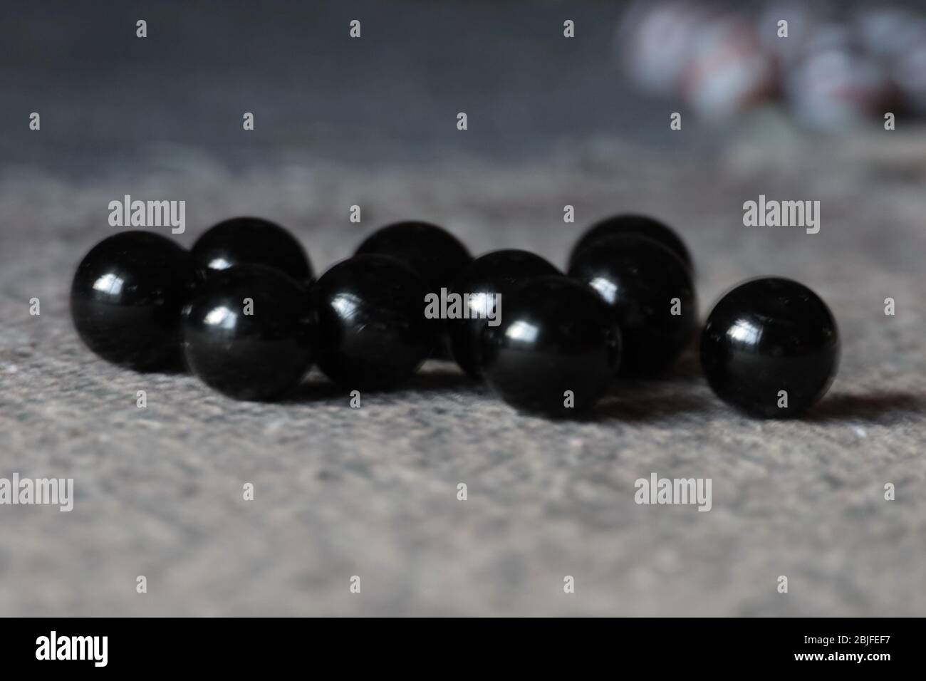 Black balls of marble Stock Photo - Alamy