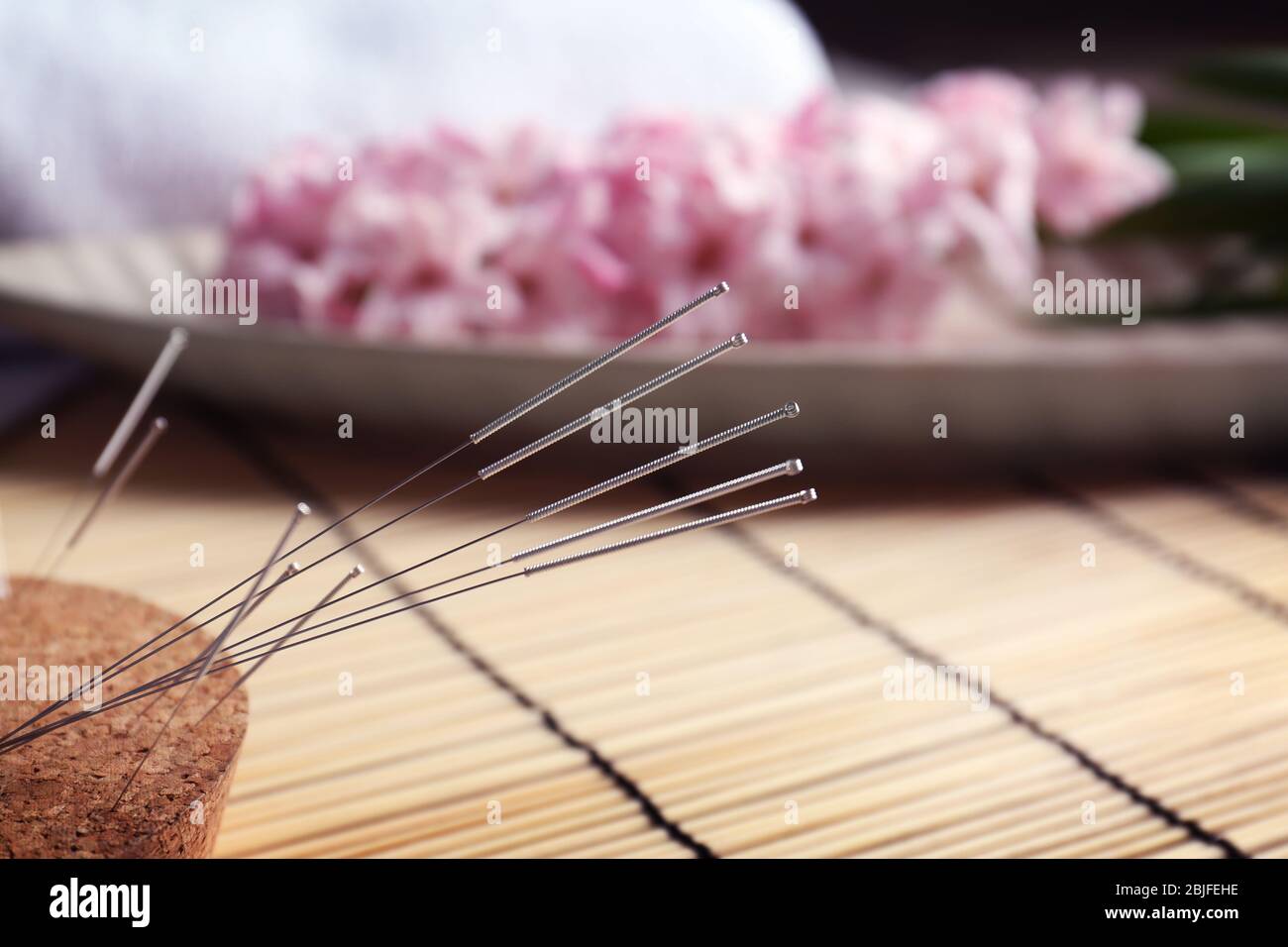 Acupuncture needles inserted into cork, closeup Stock Photo - Alamy