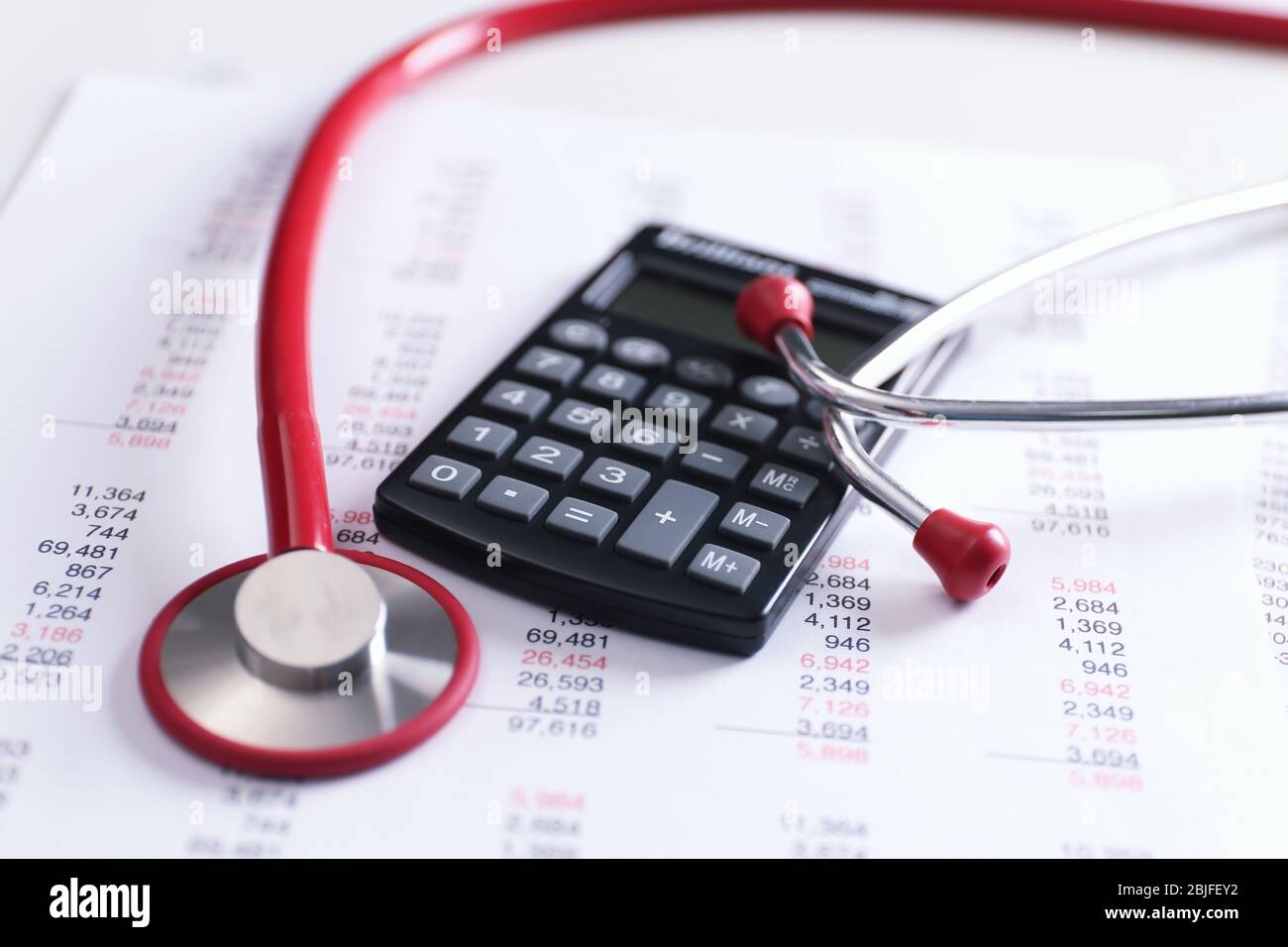 Life insurance concept. Calculator and stethoscope on bill background ...