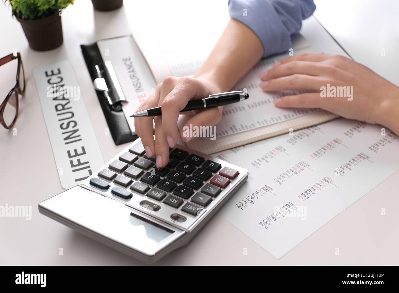 Life planning concept. Hands of insurance agent at workplace Stock ...