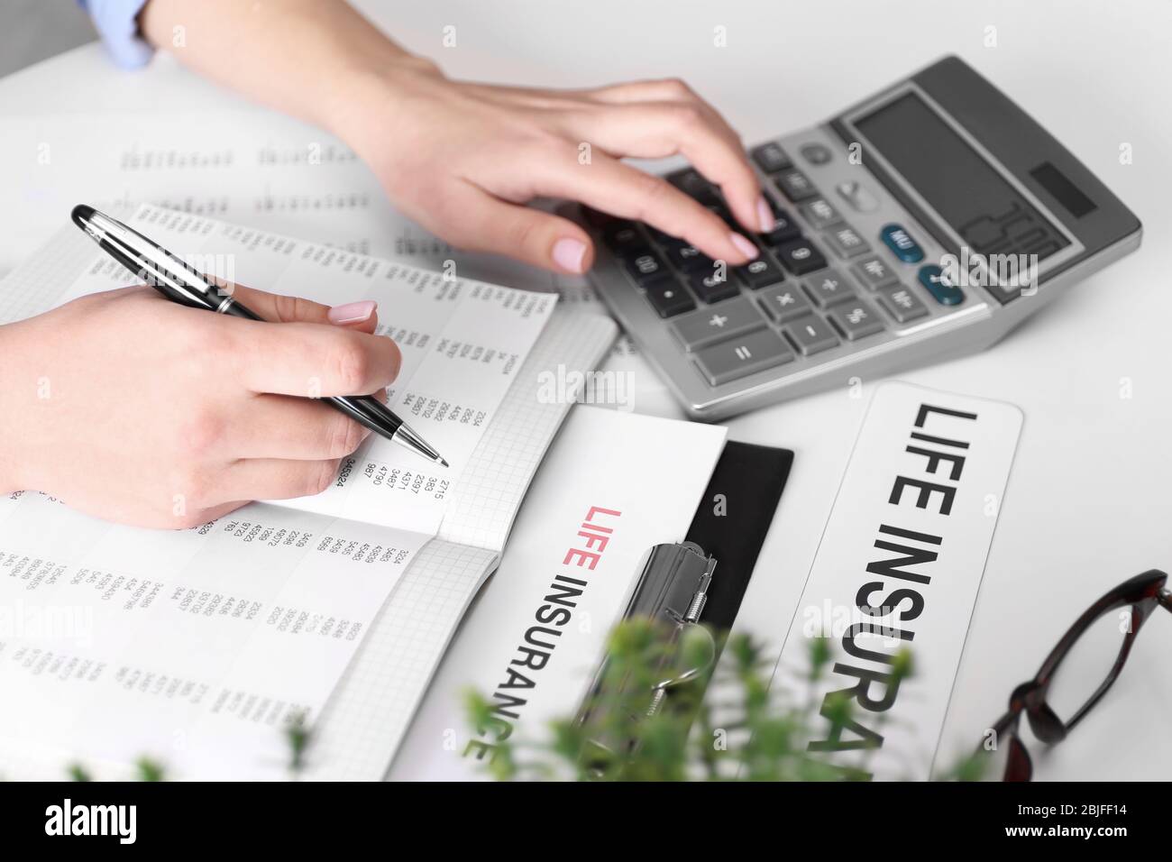 Life planning concept. Hands of insurance agent at workplace Stock ...