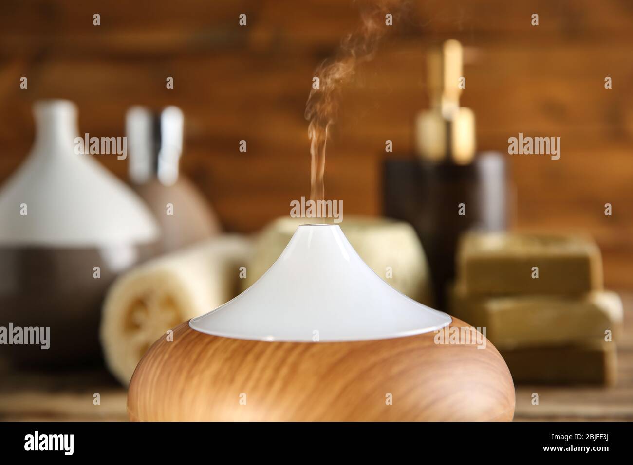 Oil diffuser on blurred background Stock Photo - Alamy