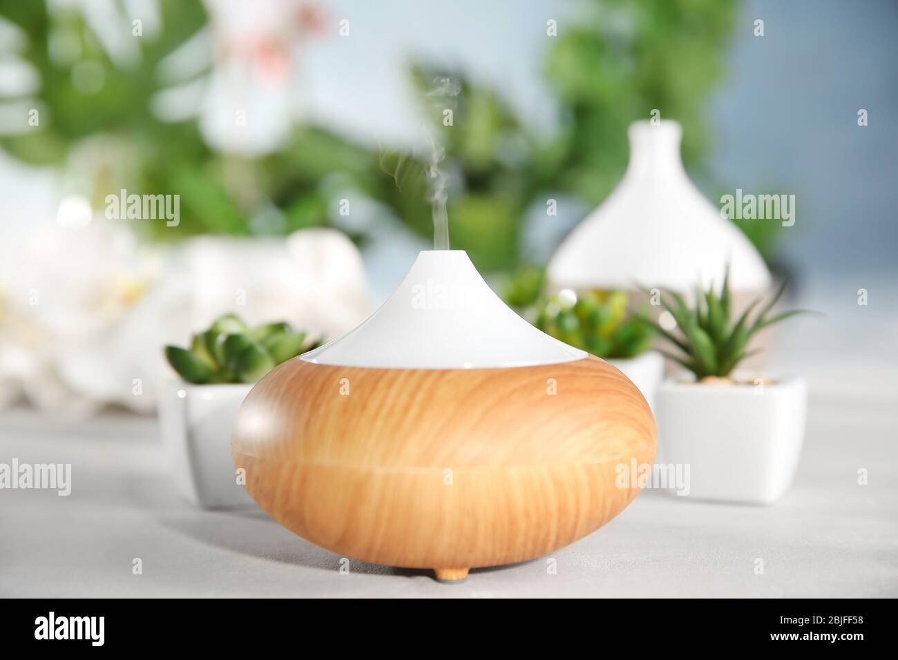 Oil diffuser on blurred background Stock Photo - Alamy