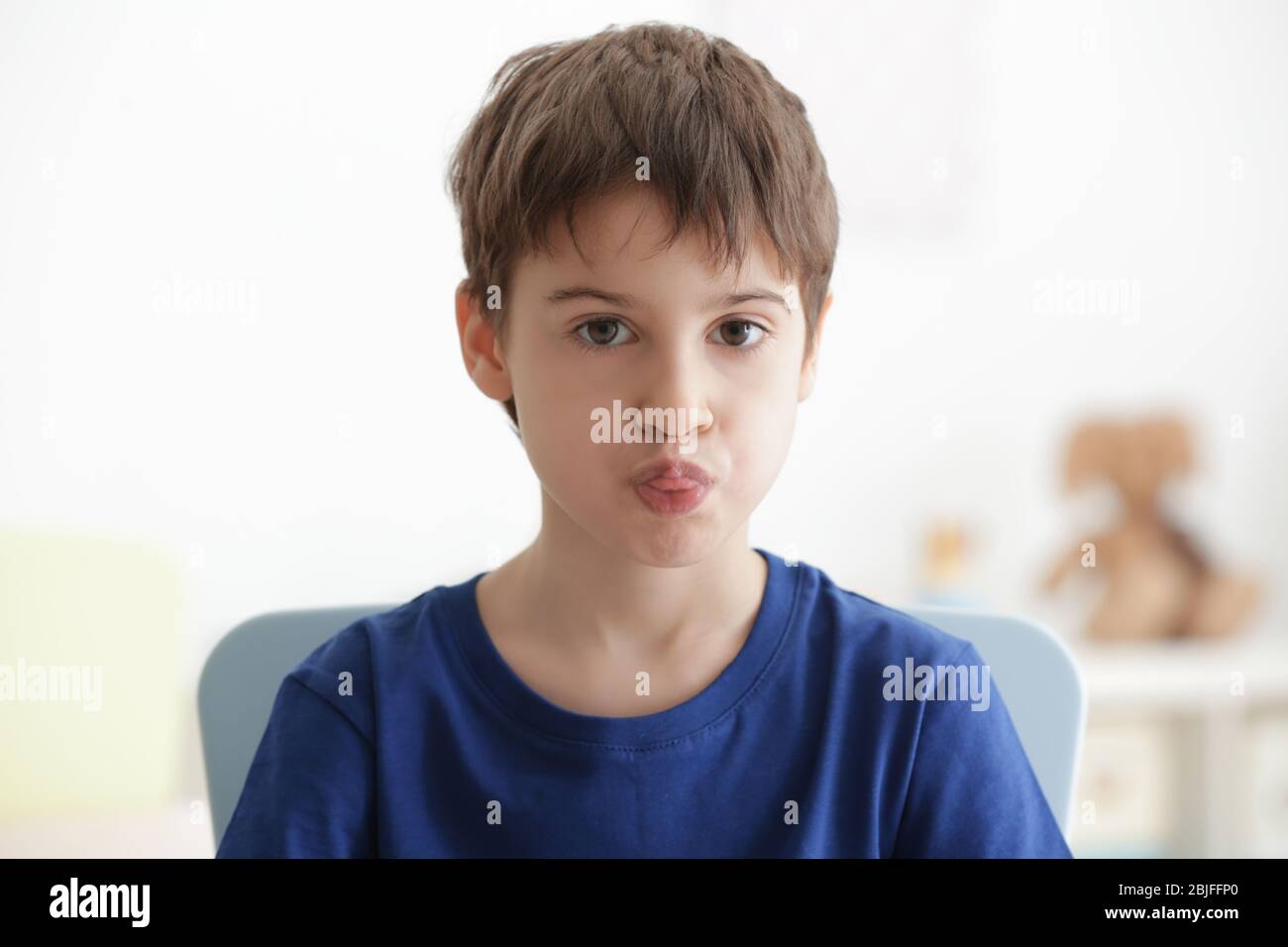 Cute little boy on blurred background Stock Photo - Alamy