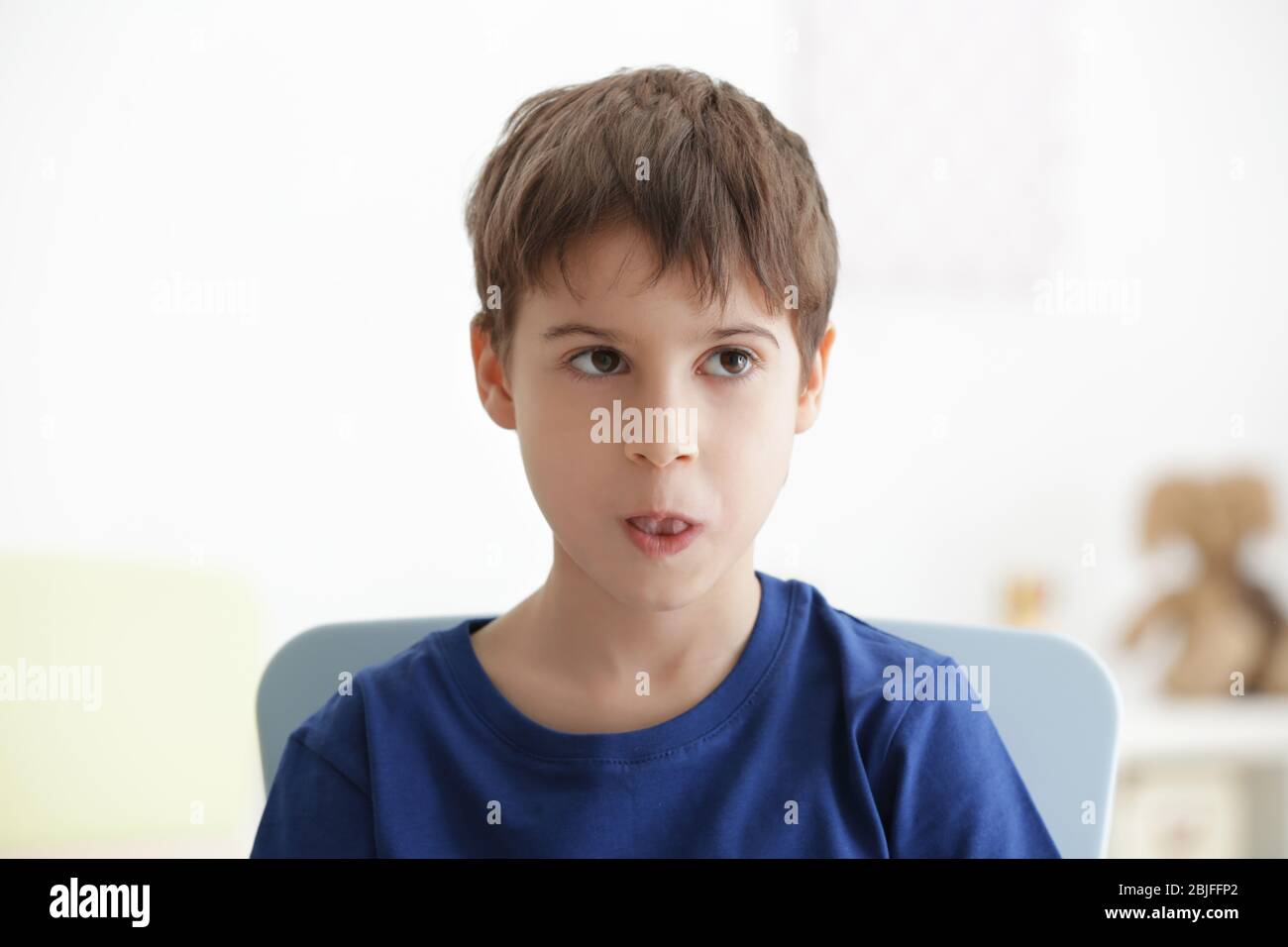 Cute little boy on blurred background Stock Photo - Alamy