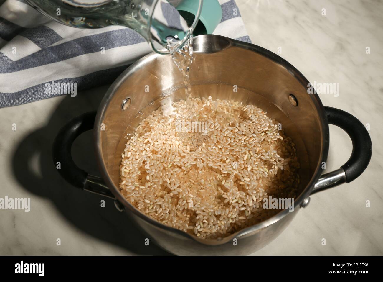 Pouring rice water glass on hi-res stock photography and images - Alamy