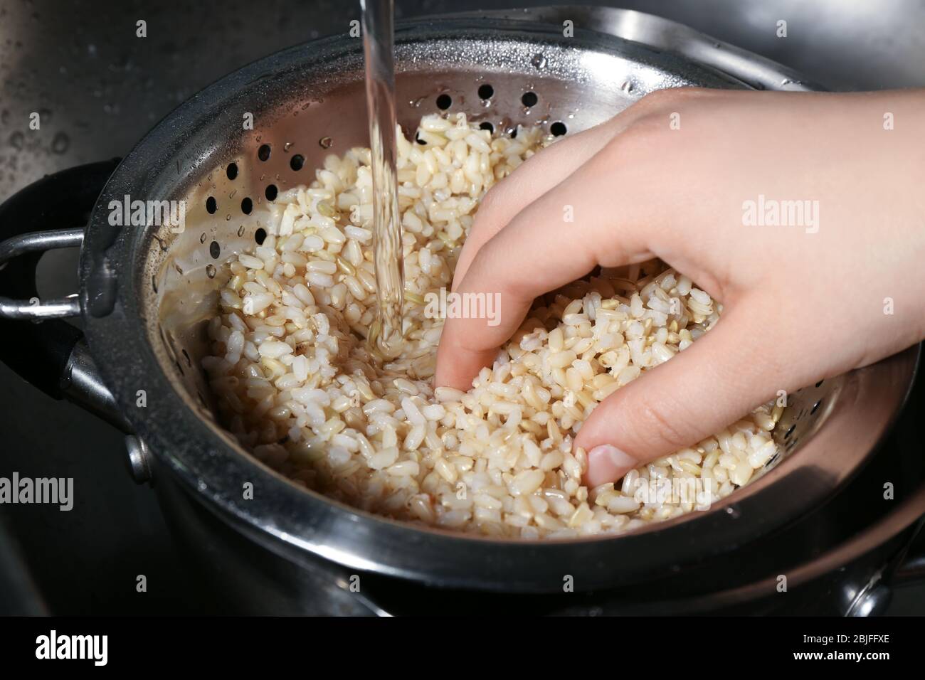 Food preparation washing rice hi-res stock photography and images - Alamy