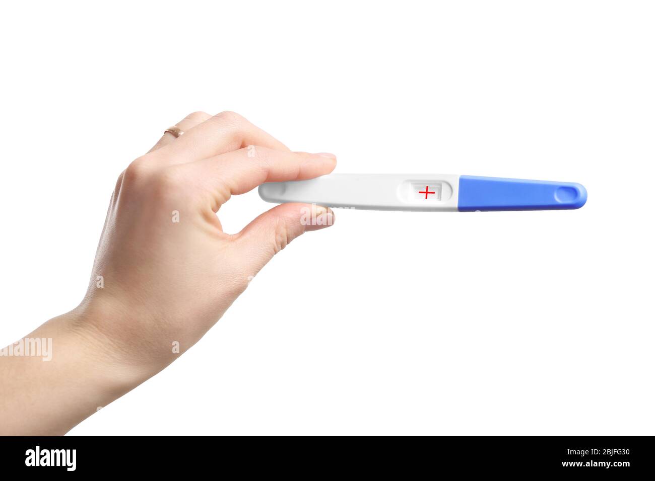 Pregnancy test in hand on white background Stock Photo - Alamy