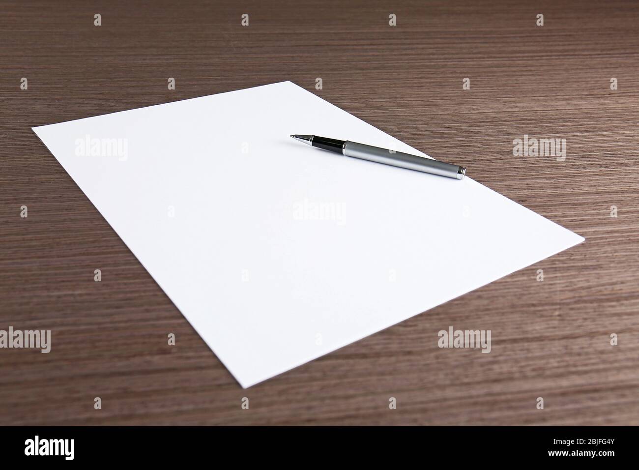 Empty paper sheet with pen on table. Job interview concept Stock Photo ...
