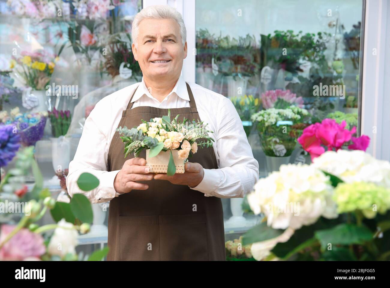 Mature male preparing flowers hi-res stock photography and images - Alamy