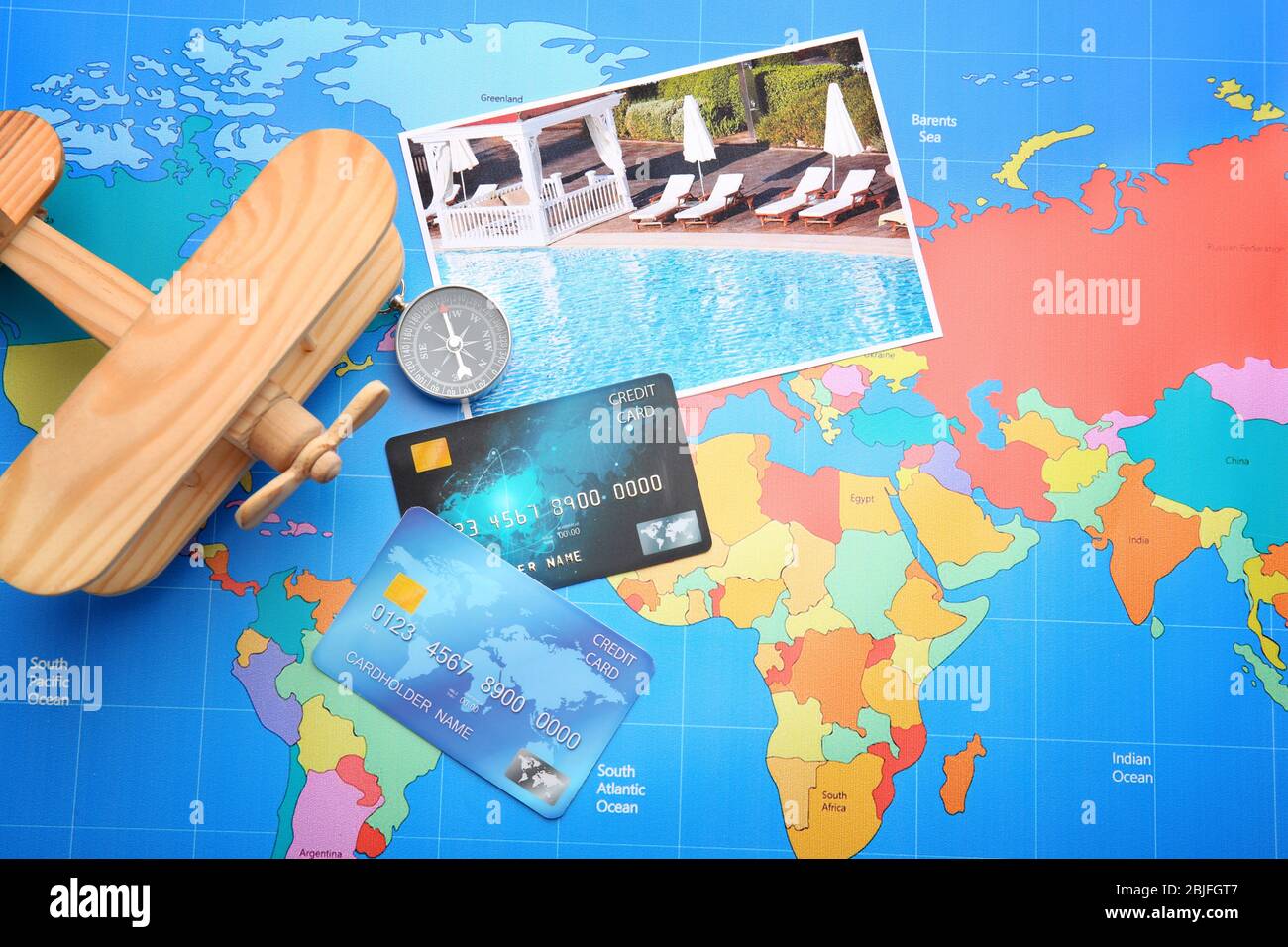 Credit cards on world map background Stock Photo - Alamy