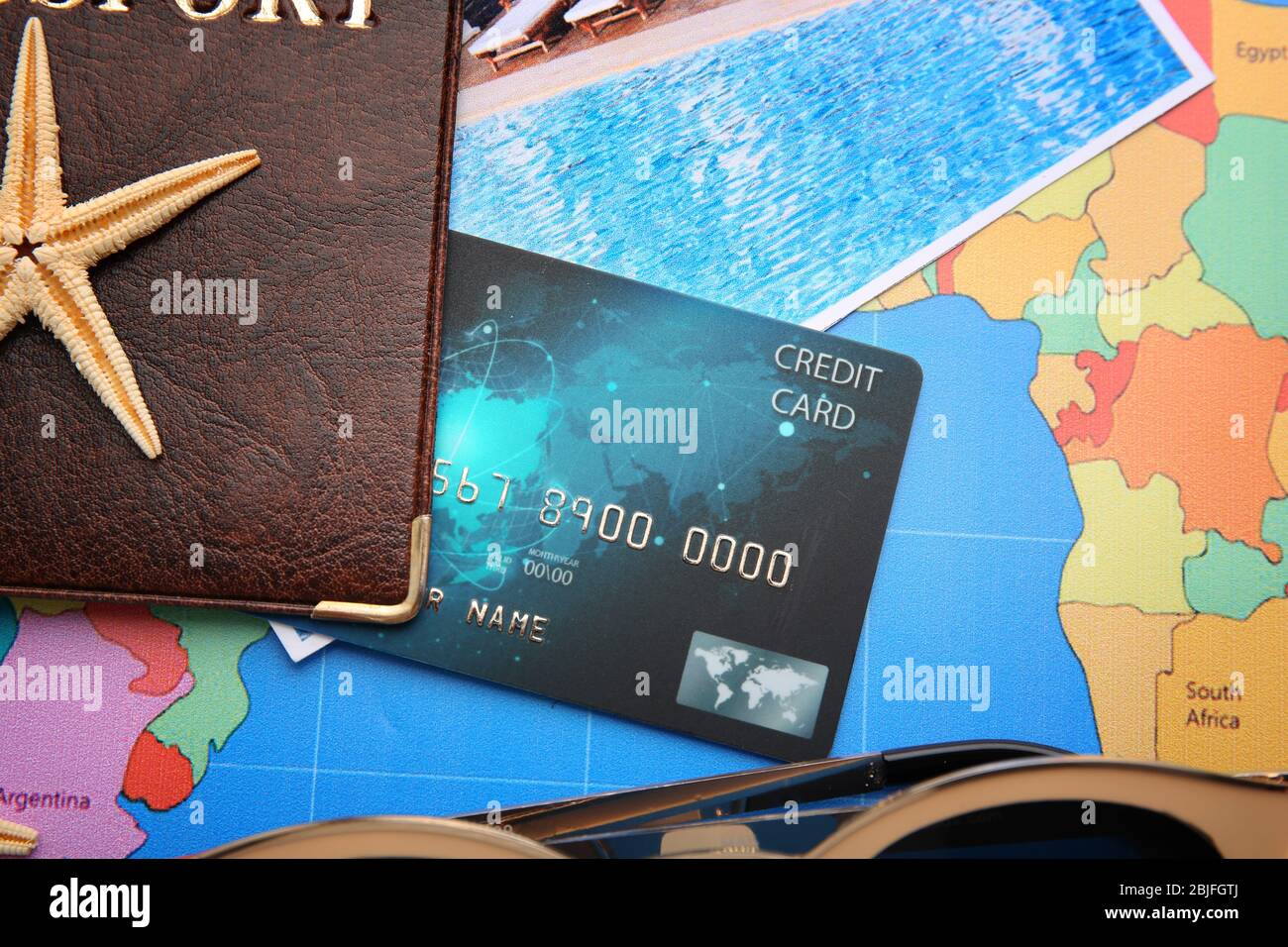 Credit card with passport on world map background Stock Photo - Alamy