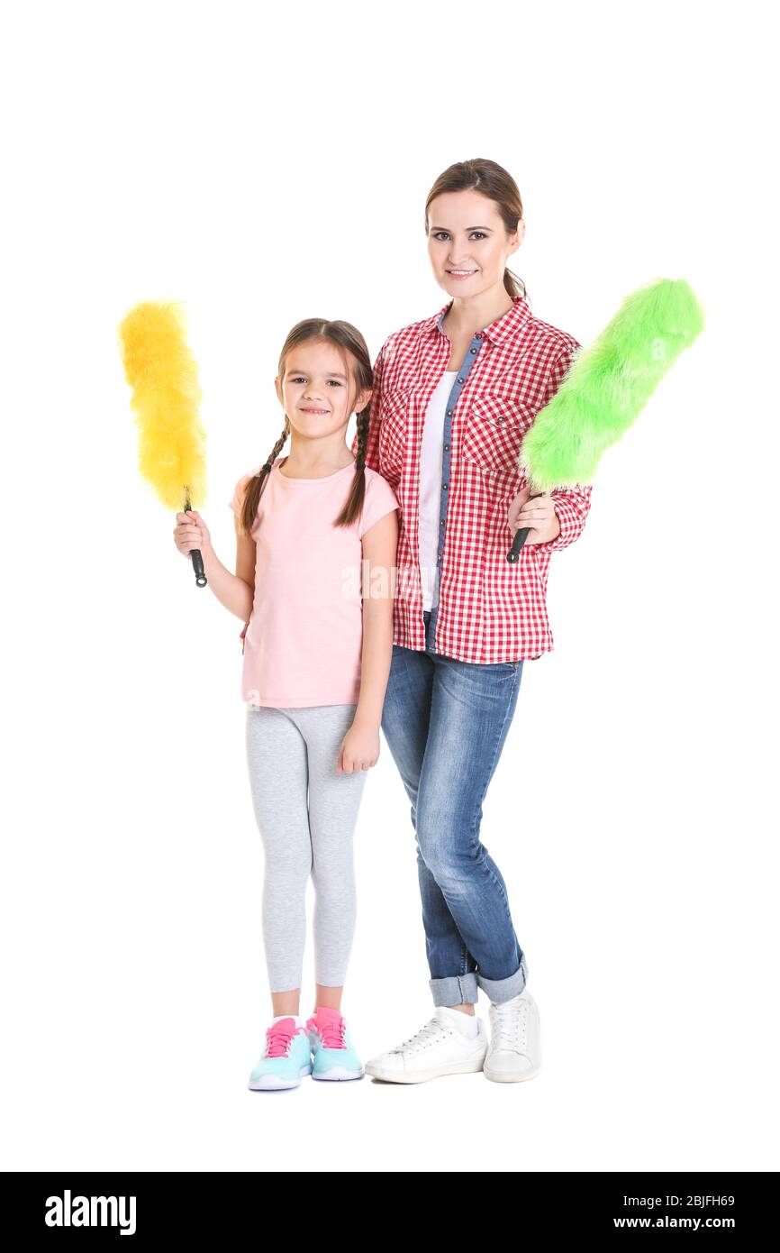 Mother and daughter with dusters, isolated on white Stock Photo - Alamy