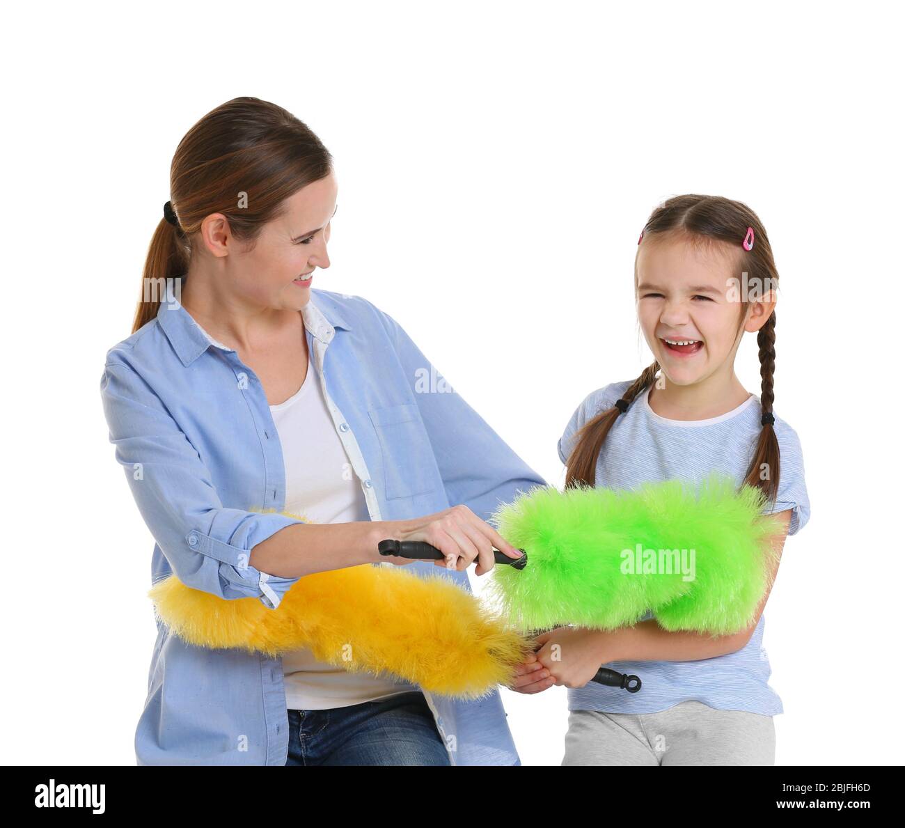 Mother and daughter with dusters, isolated on white Stock Photo - Alamy