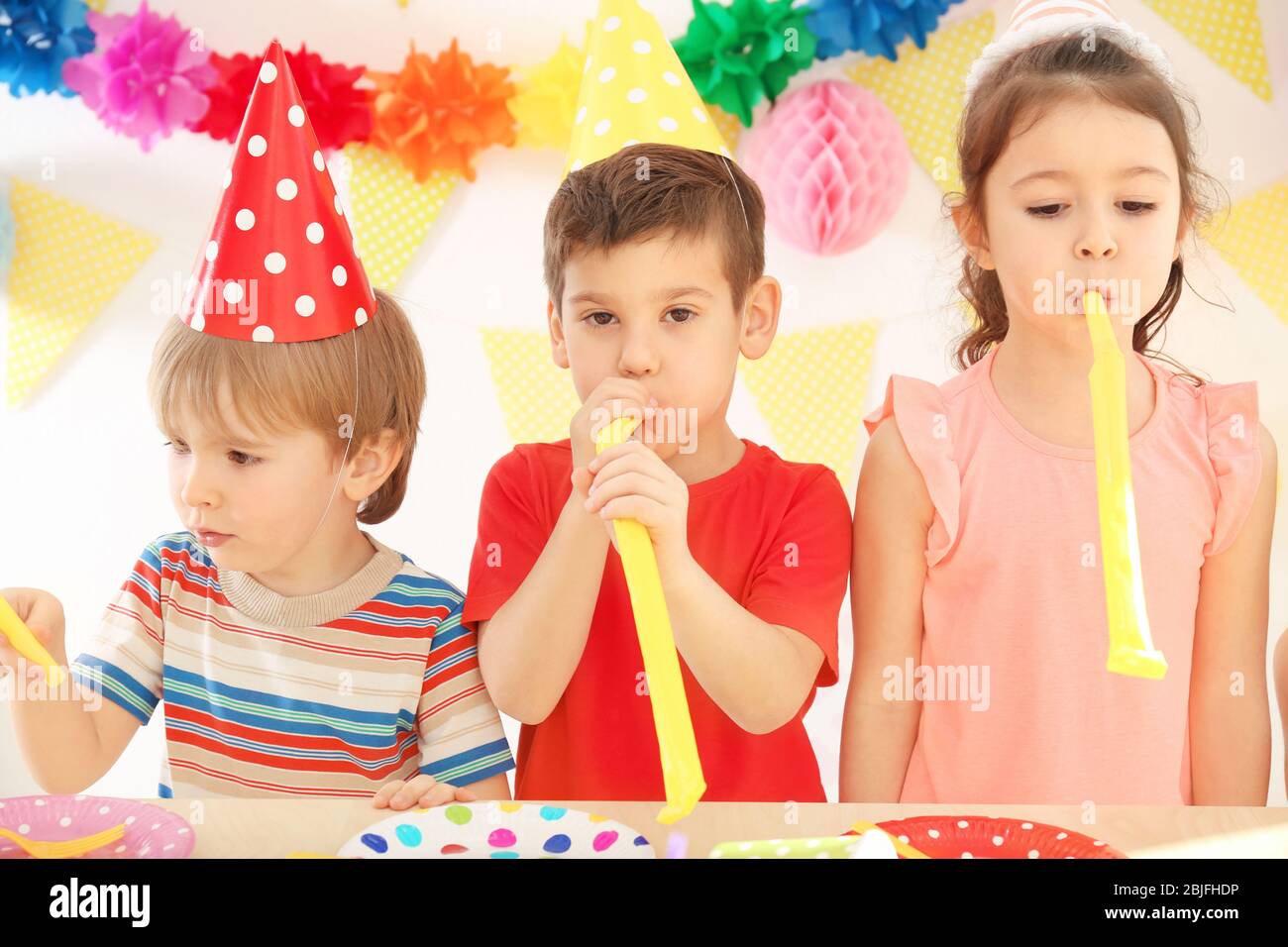 Cute little children celebrating birthday at party Stock Photo - Alamy
