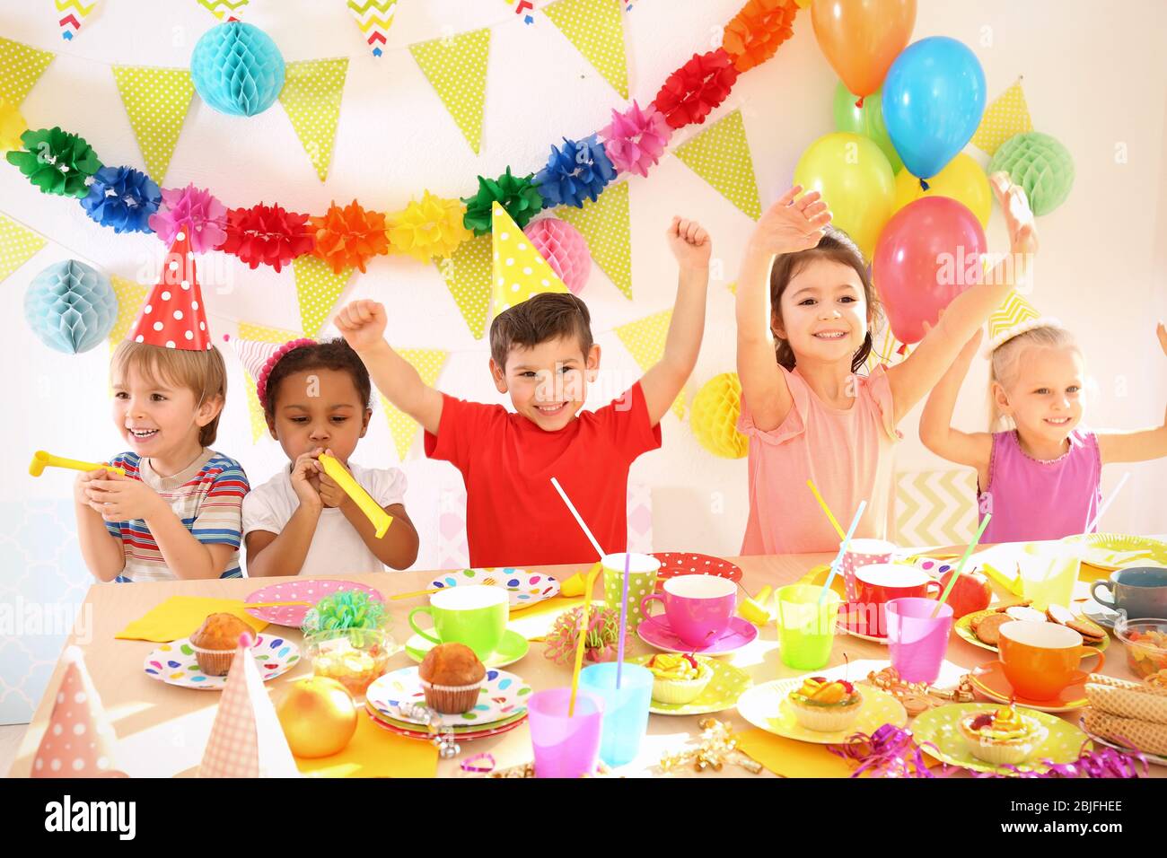 Cute little children celebrating birthday at party Stock Photo - Alamy